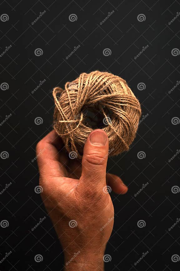 Hand holding thread stock photo. Image of ball, closeup - 192852298