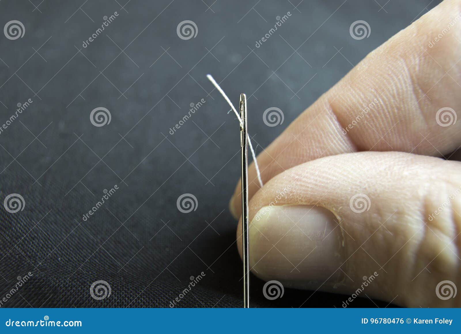 Hand Holding Thread in Needle Eye Stock Photo - Image of threading ...
