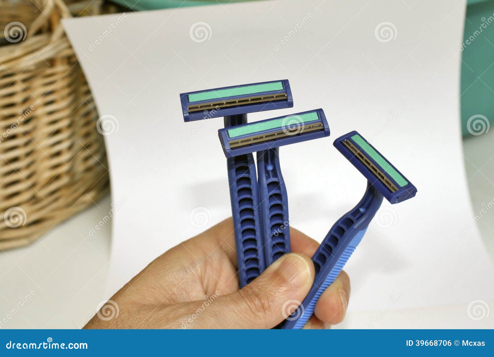Hand Holding Three Blue Razors Stock Photo - Image of handle, manual ...