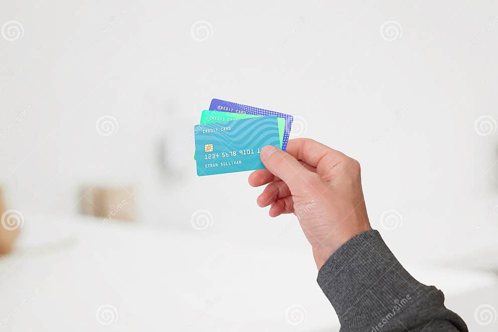Hand Holding Three Different Credit Cards, Symbolizing the Complexity ...