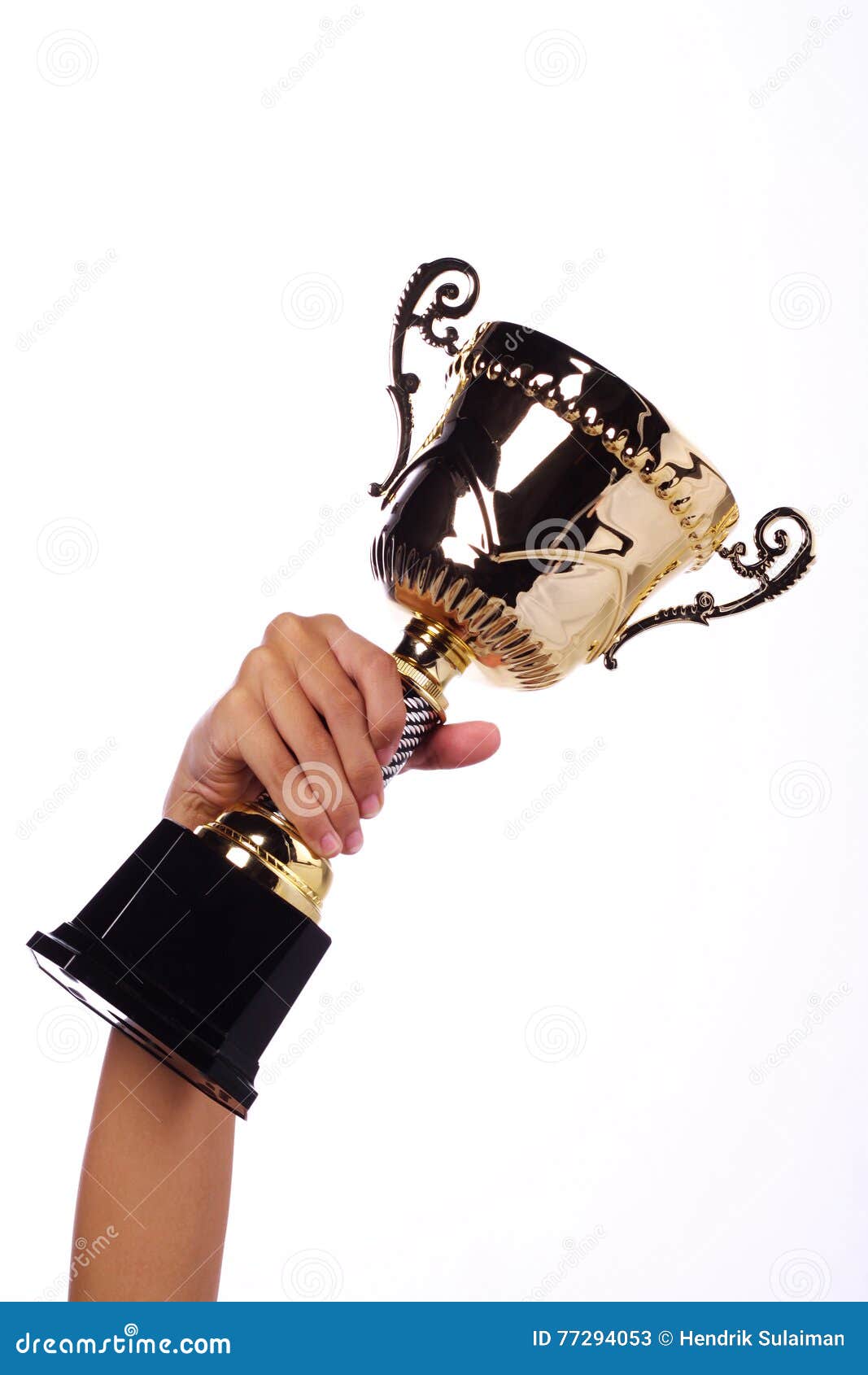 A hand holding a throphy stock image. Image of metallic - 77294053