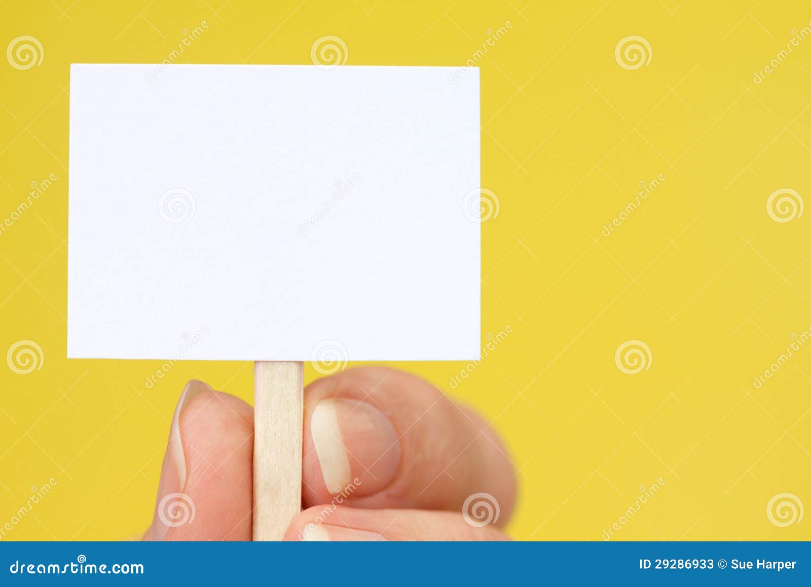 Hand Holding Tiny Sign on Yellow with Copy Space Stock Image - Image of ...