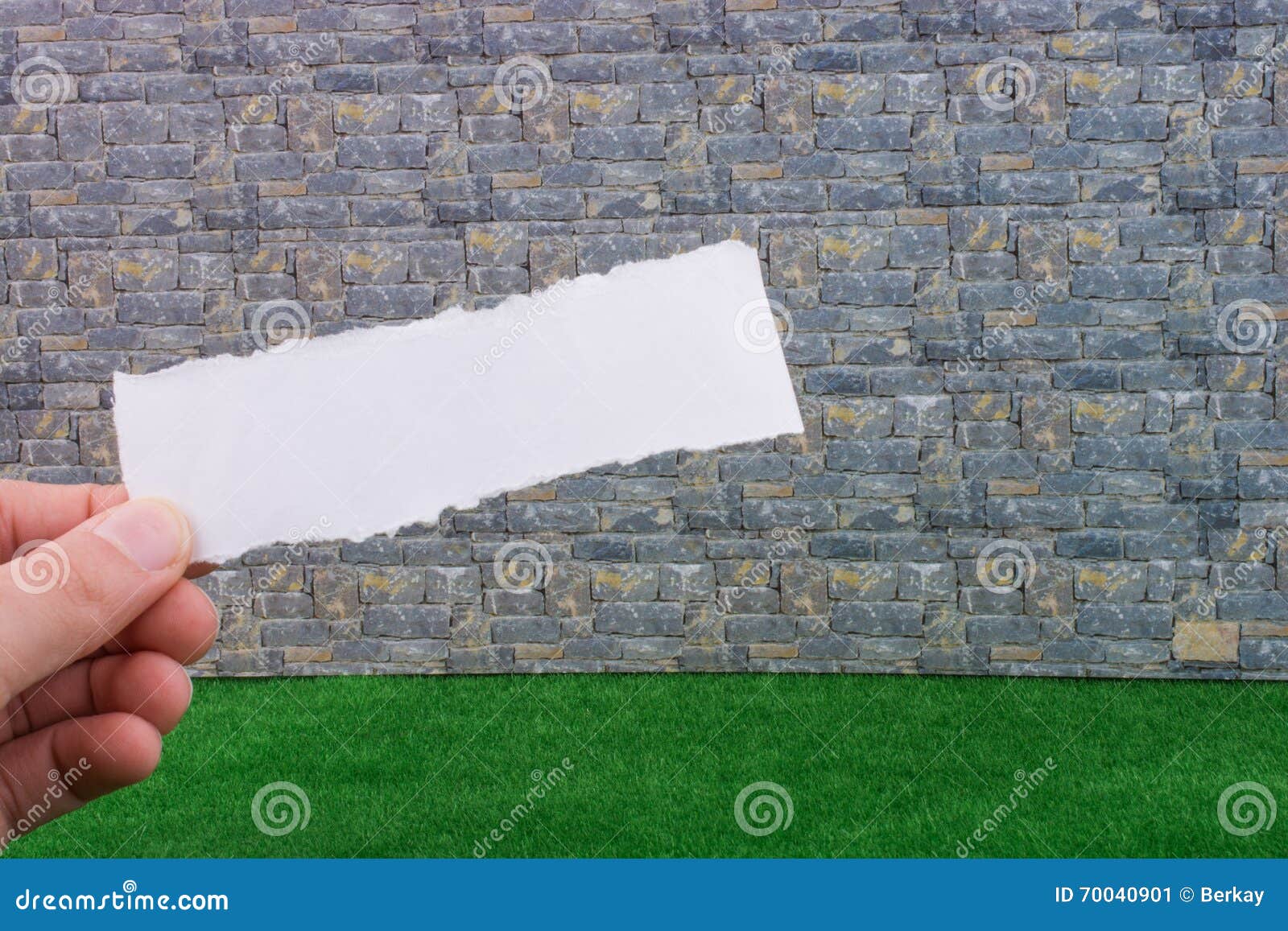 Hand holding torn paper stock image. Image of message - 70040901