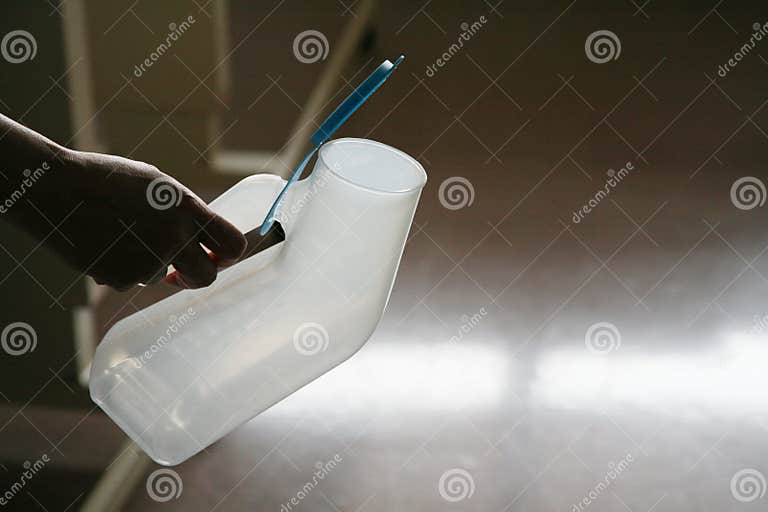 Hand holding a urinal stock photo. Image of hold, portable - 2499092
