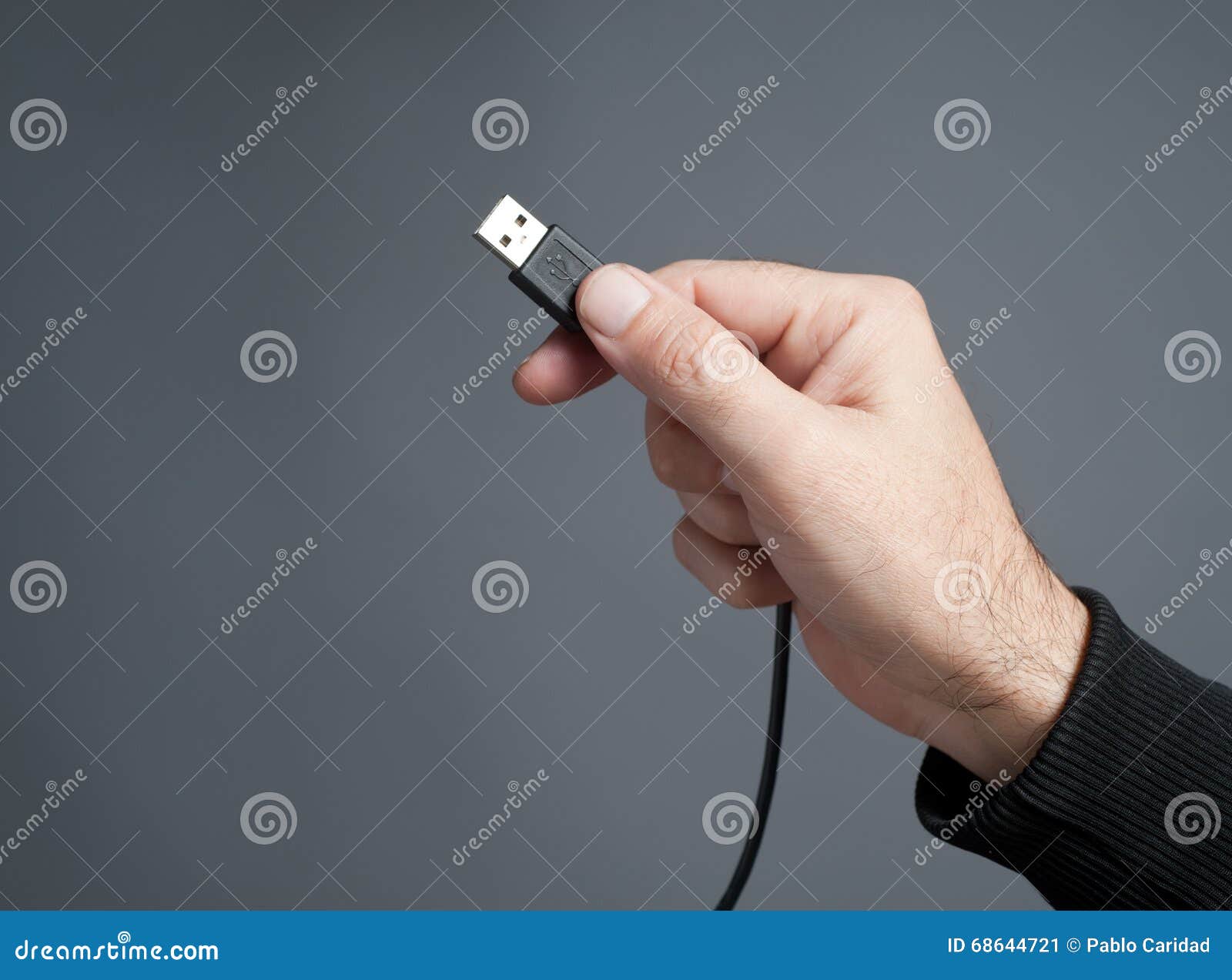 Hand holding USB cable stock image. Image of communication - 68644721