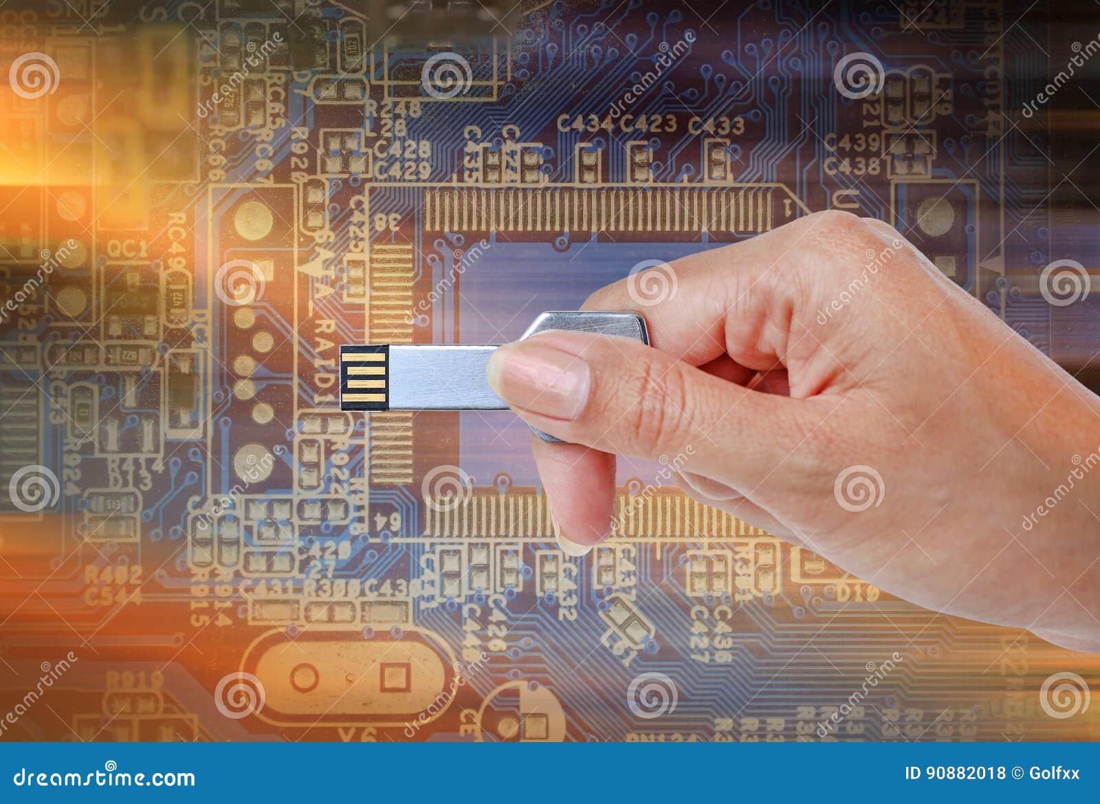 Hand Holding USB Data Storage Against Bright Light and Circuit Stock ...