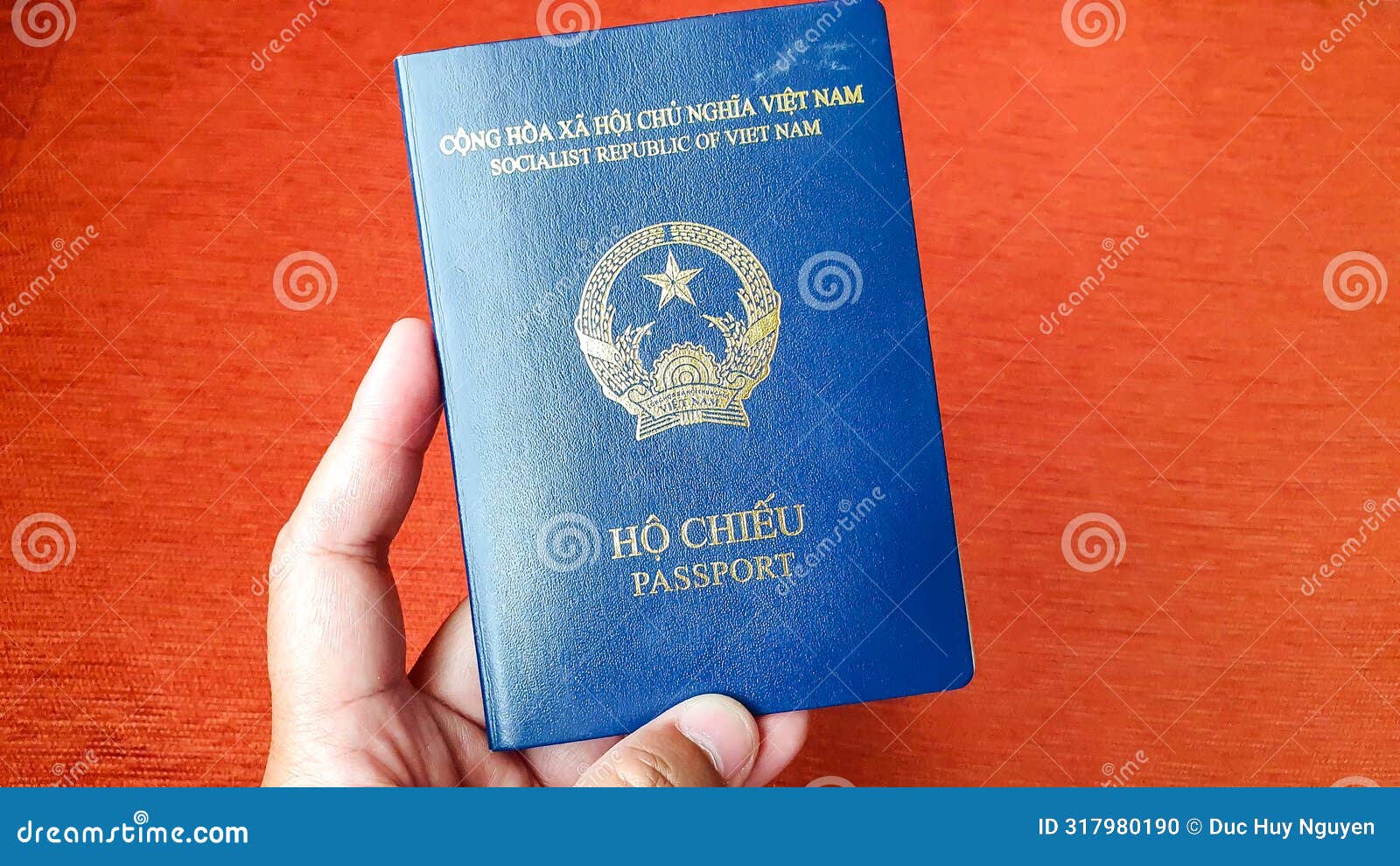 Hand Holding Vietnam Passport on Orange Background. Stock Photo - Image ...