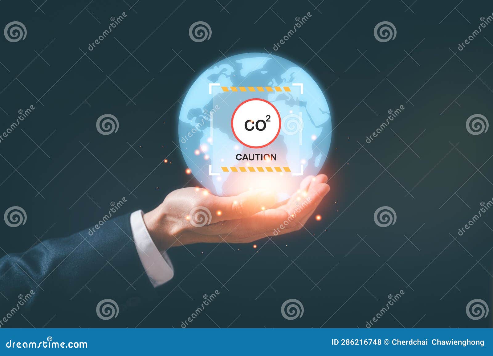 Hand Holding Virtual Glob and Caution Sign CO2 Reducing Icon in Concept of Decrease Carbon ...