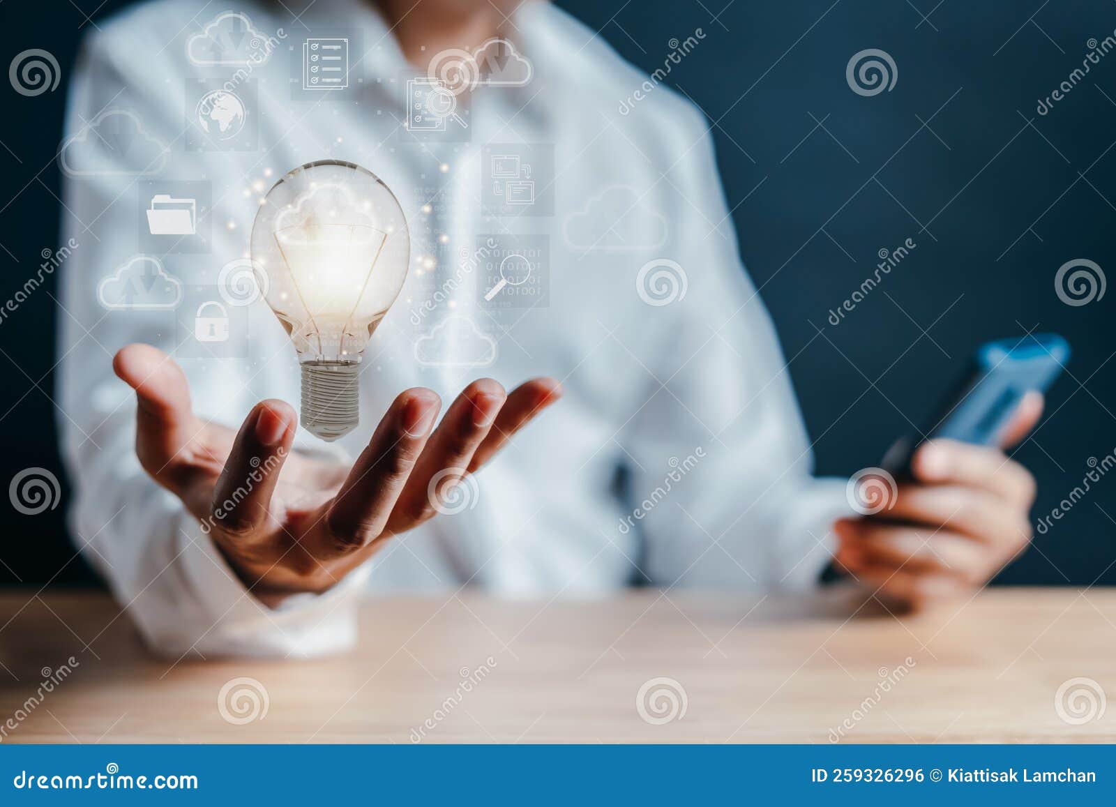 Hand Holding Virtual Lightbulb with Cloud Computing and Technology Icon ...