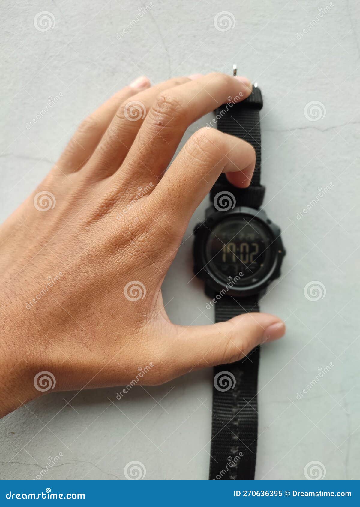 The Hand that is Holding a Watch, Makes the Watch Seem To Be Alive ...