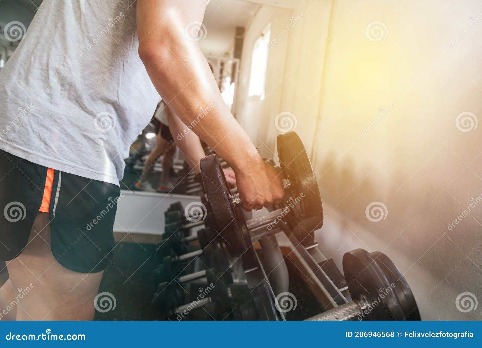 Hand Holding Weight in the Gym. Close Up. Focus is on Hand. GYM Concept ...