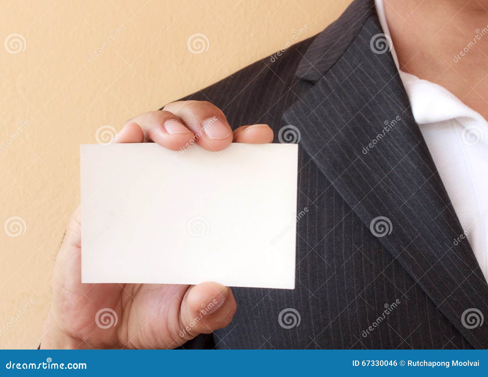 Hand holding a white card stock photo. Image of credit - 67330046