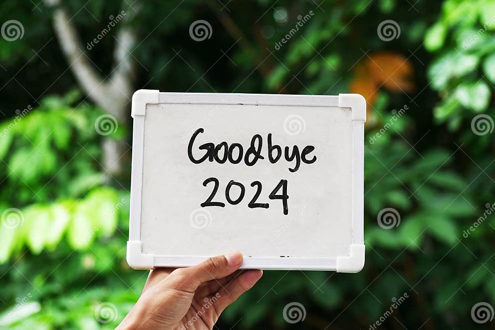A Hand Holding a Whiteboard with Text Goodbye 2024 Stock Image - Image ...