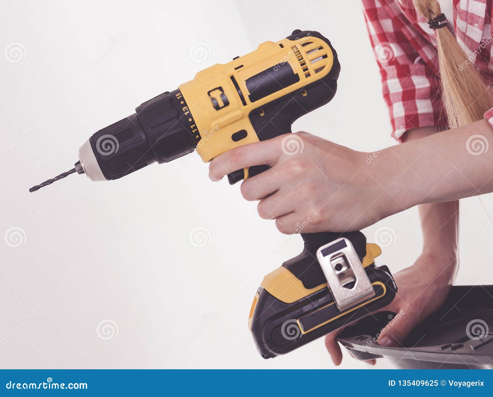 Hand holding yellow drill stock image. Image of holding - 135409625