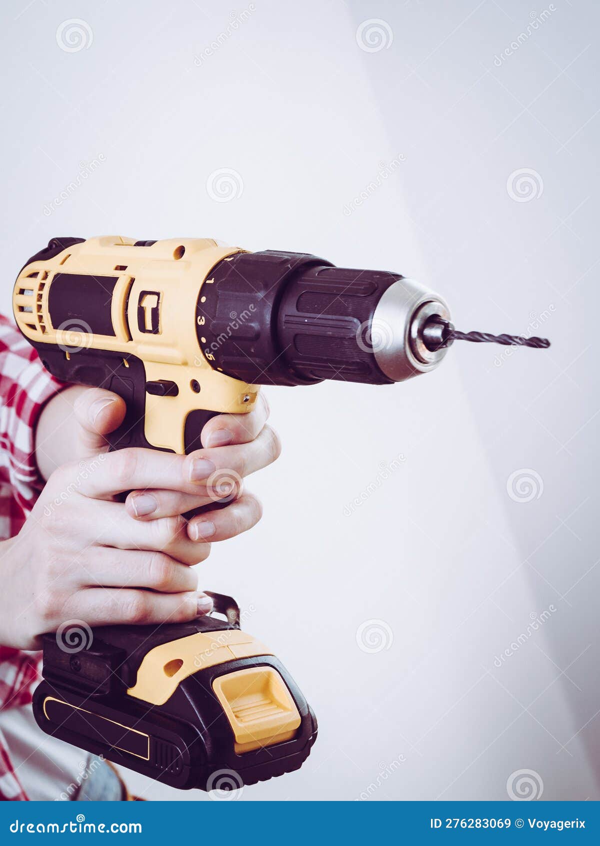 Hand holding yellow drill stock image. Image of unrecognizable - 276283069