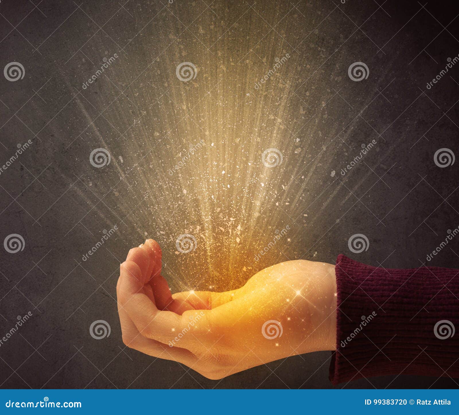 Hand holding yellow light stock photo. Image of glitter - 99383720