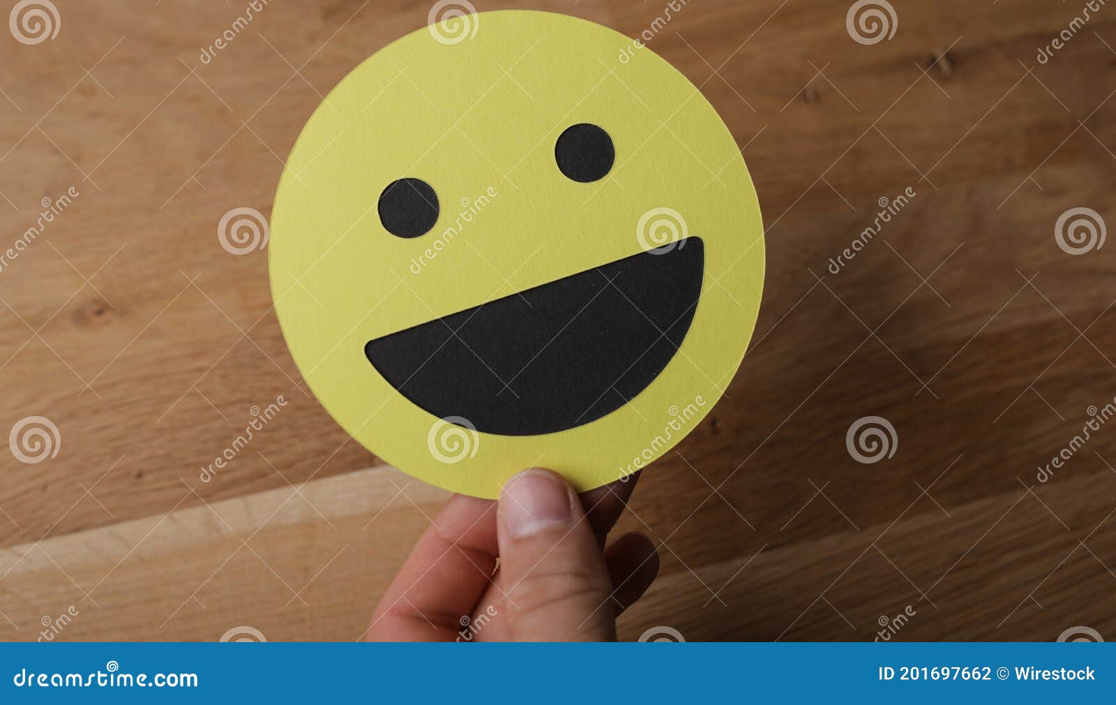 Hand Holding a Yellow Smiley Emoji Stock Photo - Image of yellow, smile ...