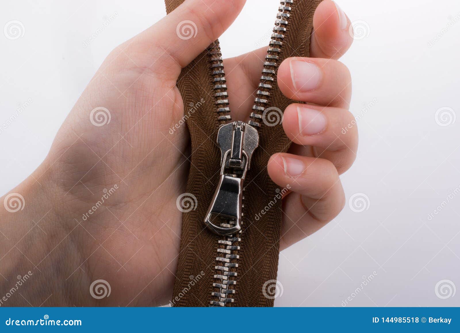 Hand holding zipper stock photo. Image of element, cloth - 144985518