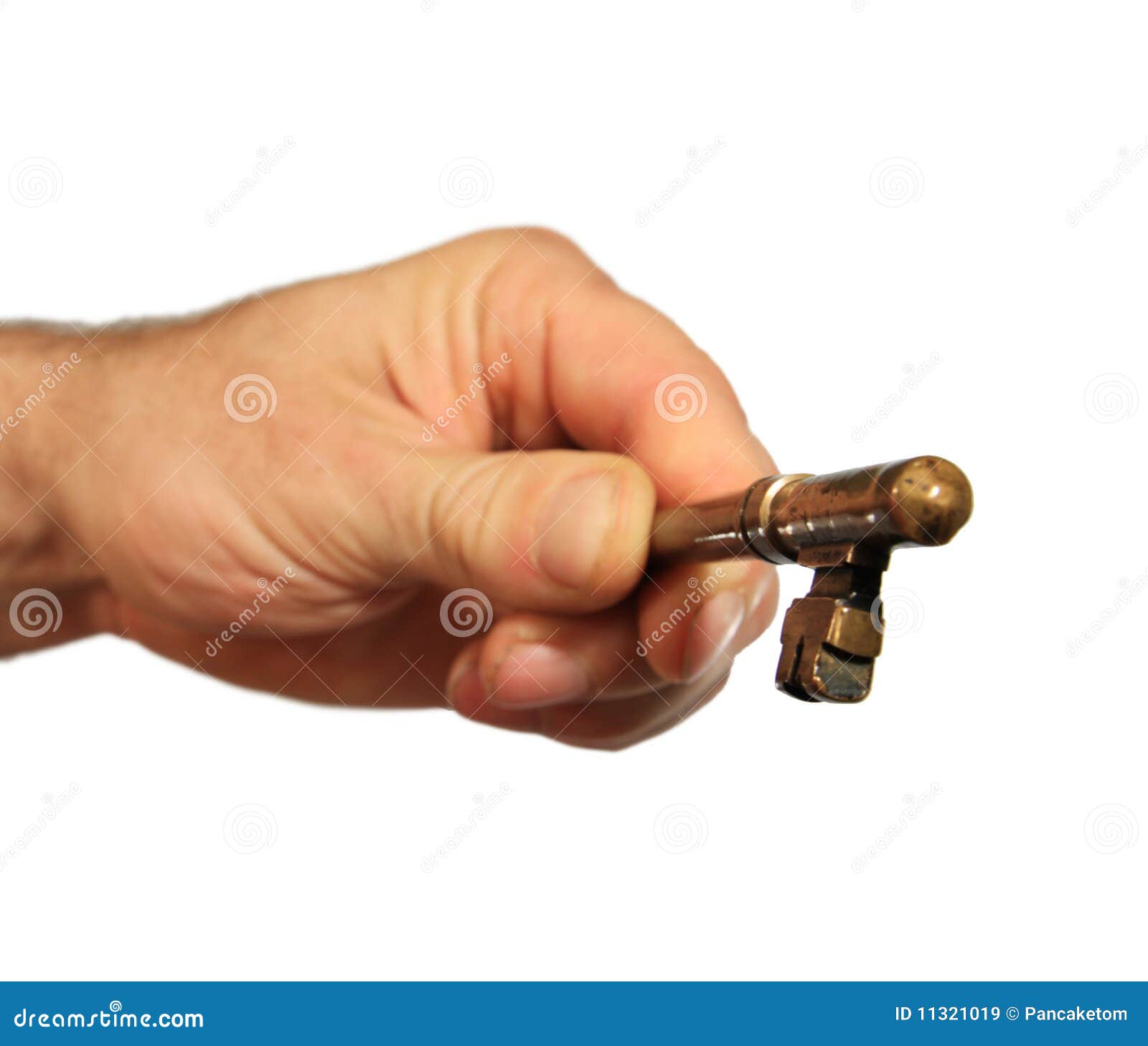 Hand holds brass key stock image. Image of antique, unlocking - 11321019