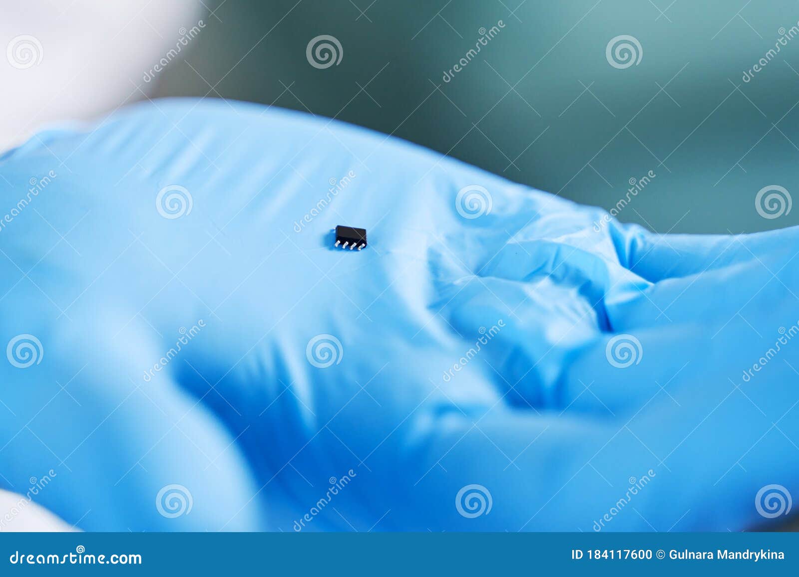 Hand Holds Chip Compenent. Embedding The Chip Under Human Skin ...