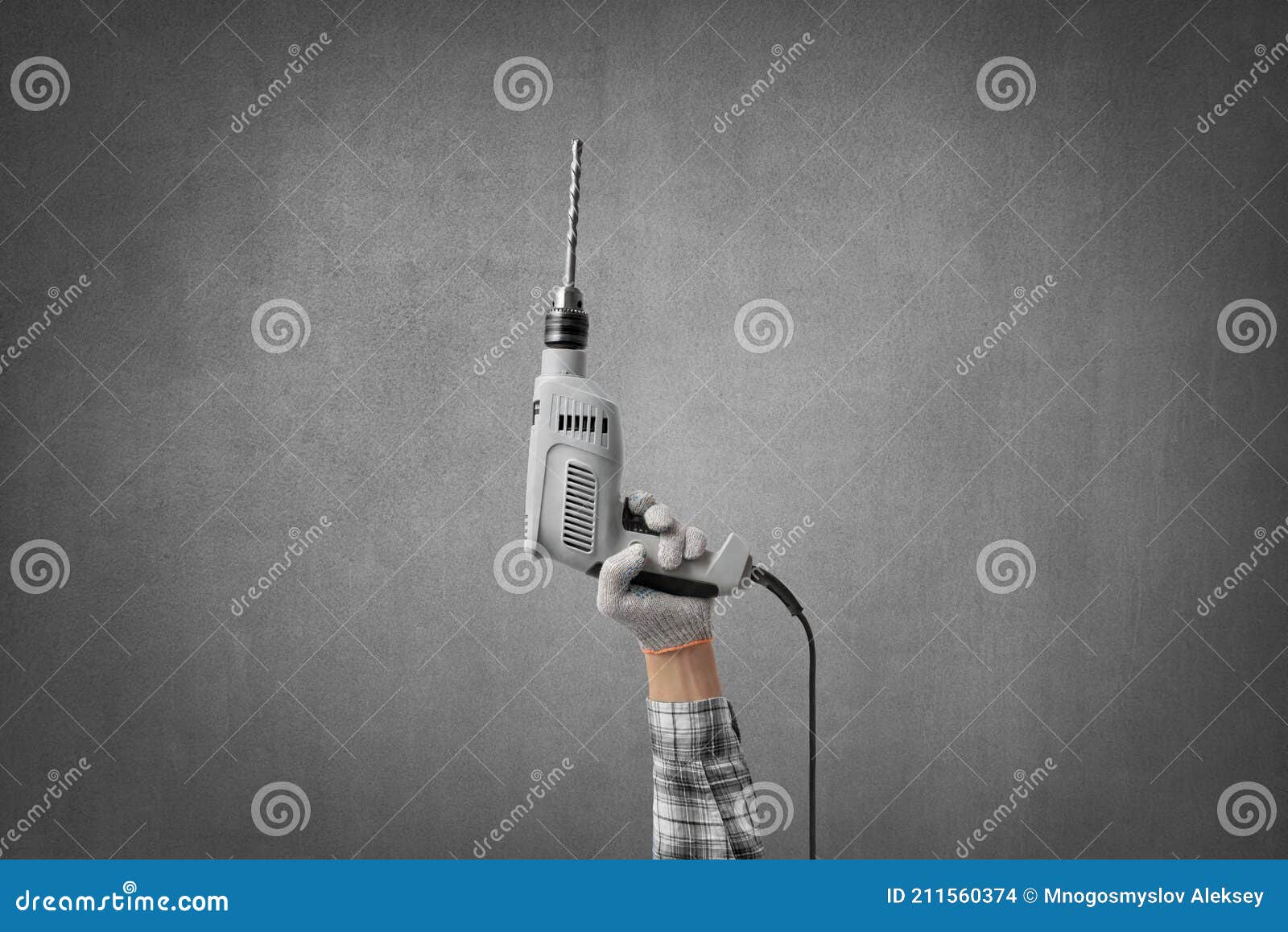 Hand Holds a Construction Tool Electric Drill - Perforator Stock Photo ...