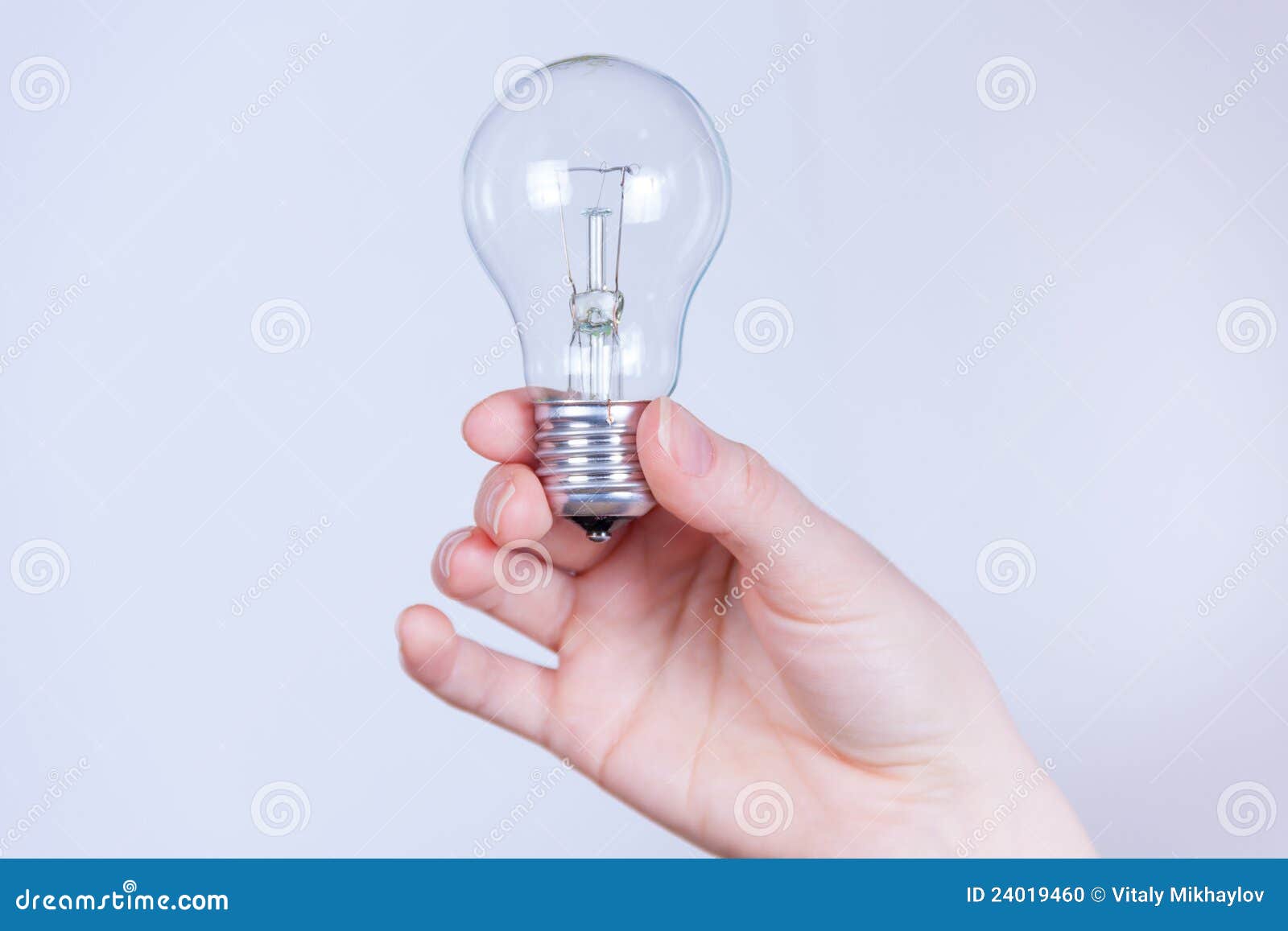 Hand Holds the Electrical Lamp Stock Photo - Image of caucasian ...
