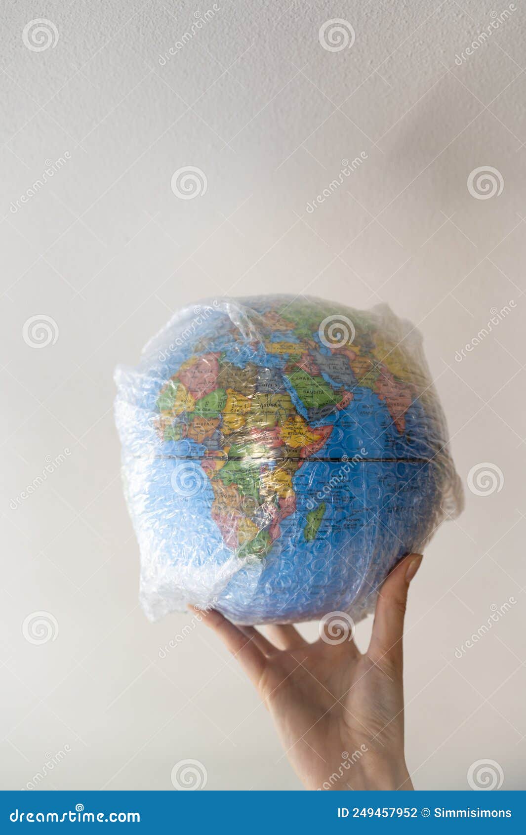 Hand Holds a Globe Wrapped in Plastic Stock Photo - Image of concept ...
