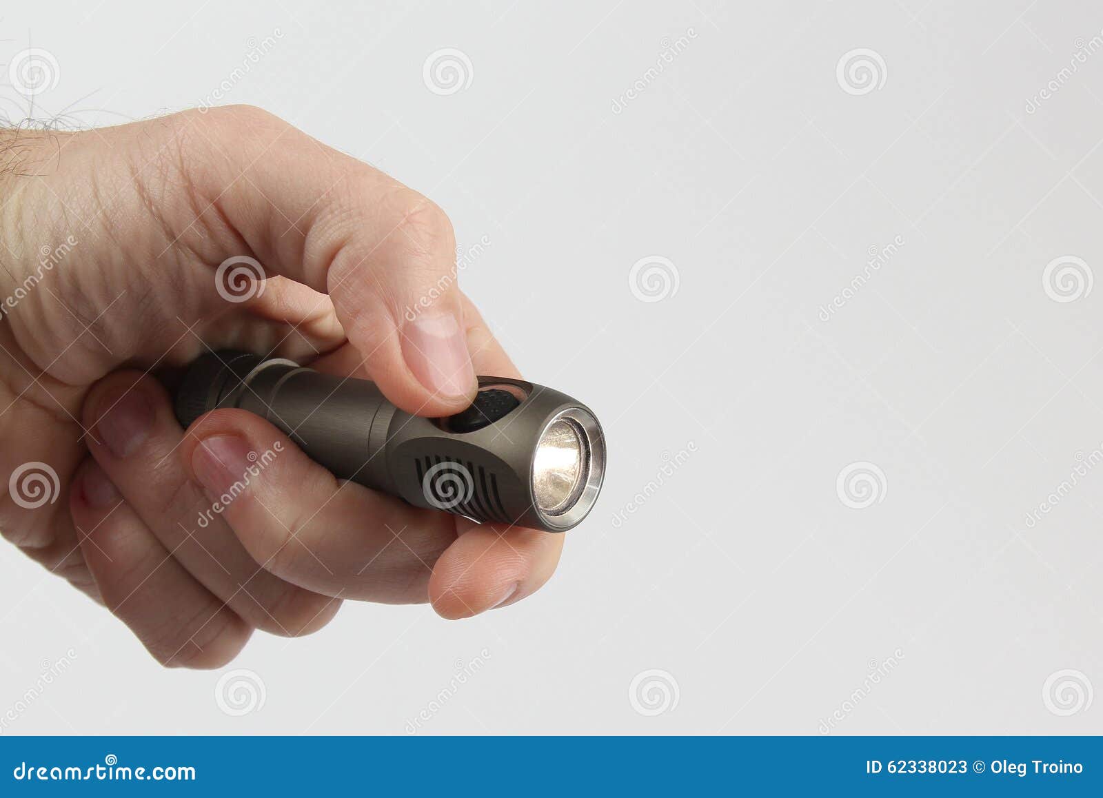 Hand Holds Included a Small Flashlight on a White Background Stock ...