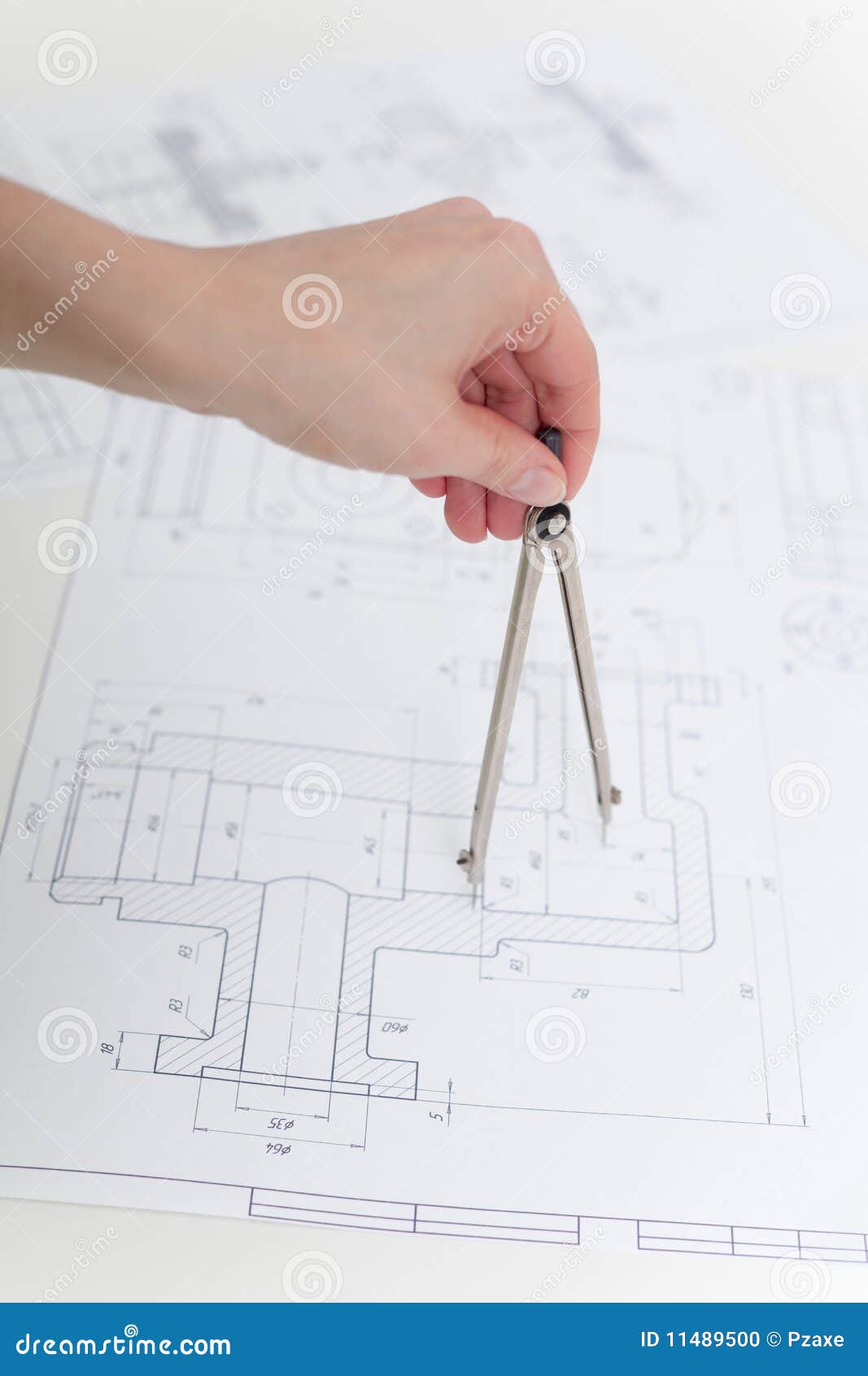 Hand Holds Metal Compasses Against Drawings Stock Photo - Image of ...