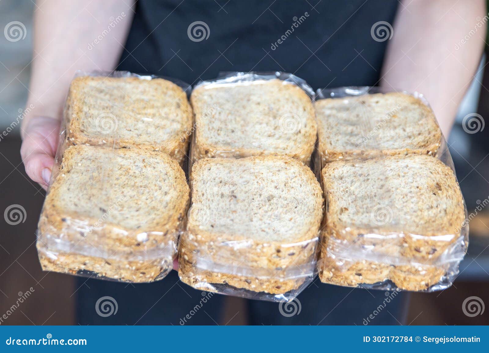 A Hand Holds 2 Packs of Bread. the Process of Preparing Sandwiches ...