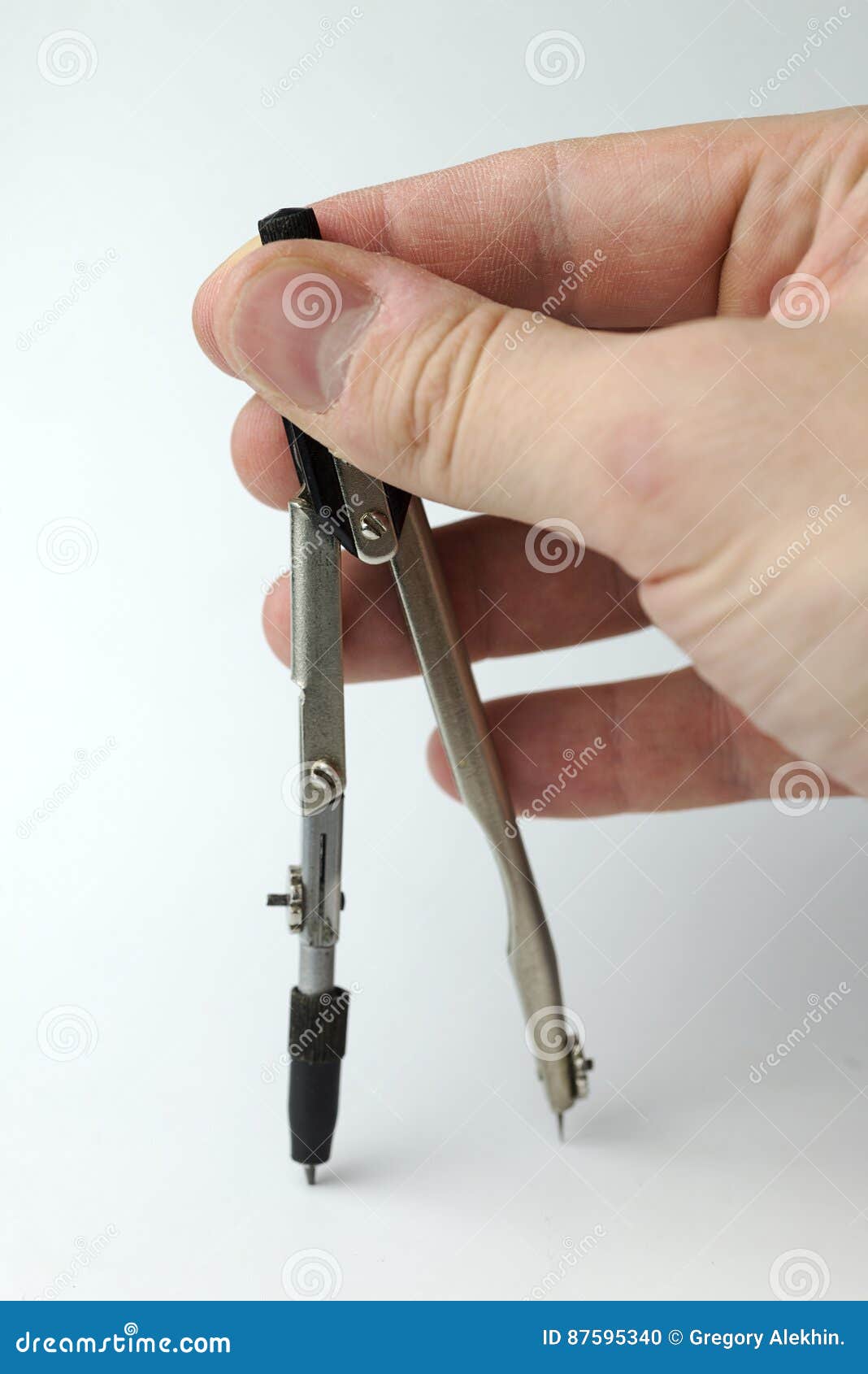 Hand Holds a Pair of Compasses. Stock Photo - Image of draw, math: 87595340