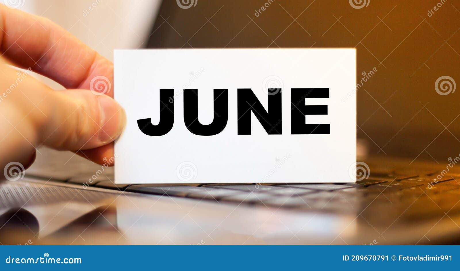 Hand Holds a Paper with the Name of the Summer Month - June Stock Image ...