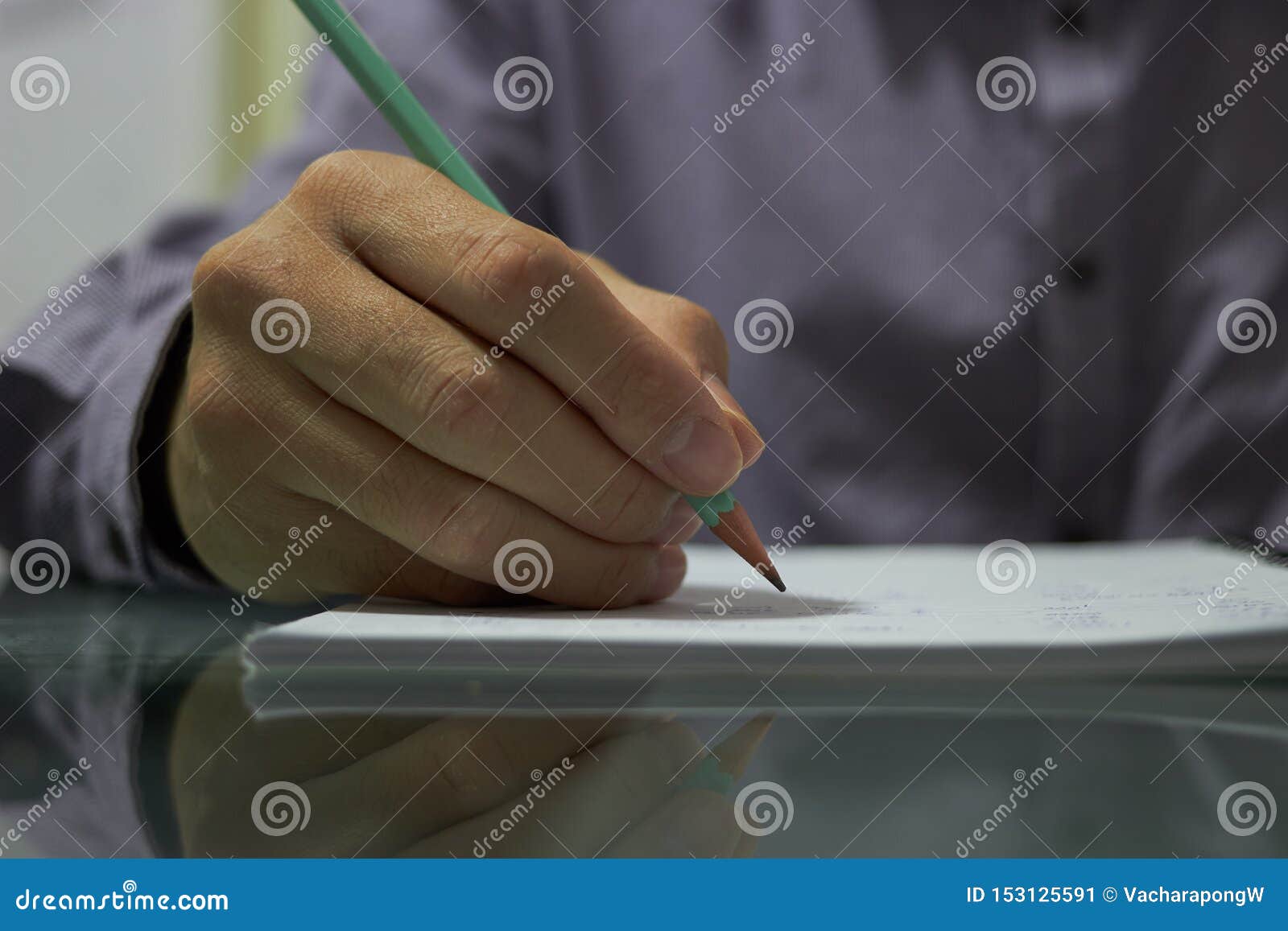 Hand Holds Pencil Writing on Paper of Notebook Stock Image - Image of ...