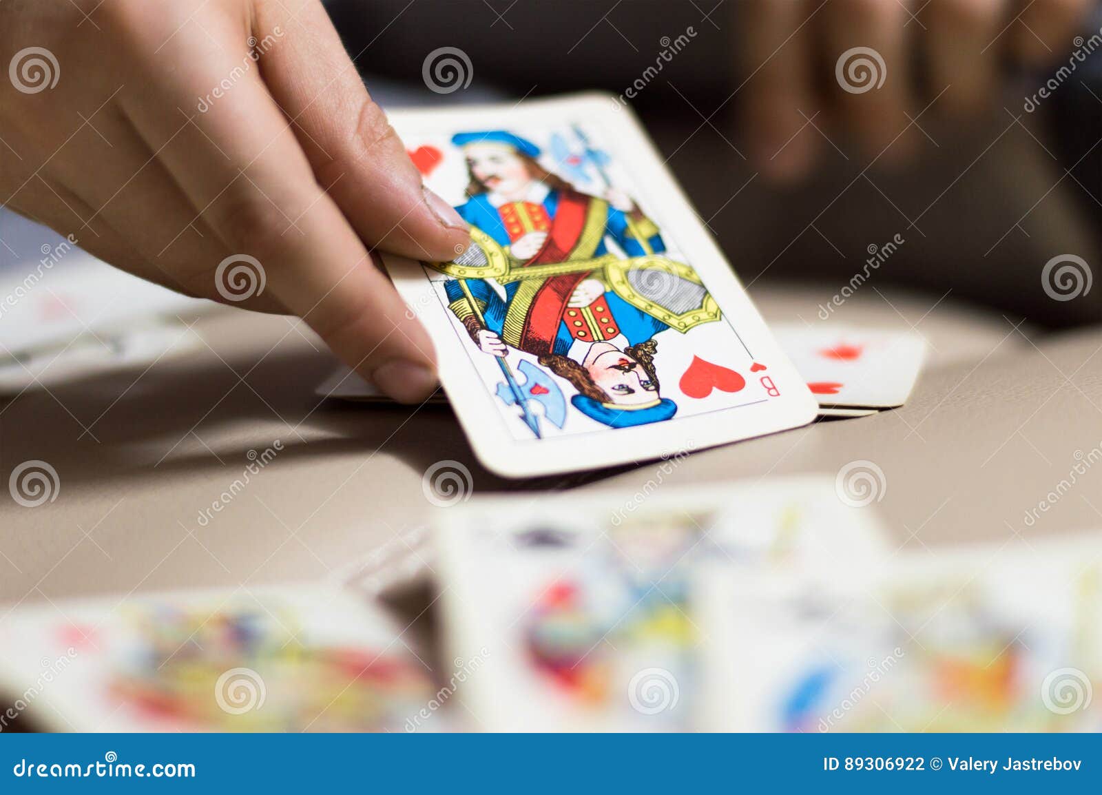 The Hand Holds a Playing Card Stock Photo - Image of reflects, game ...