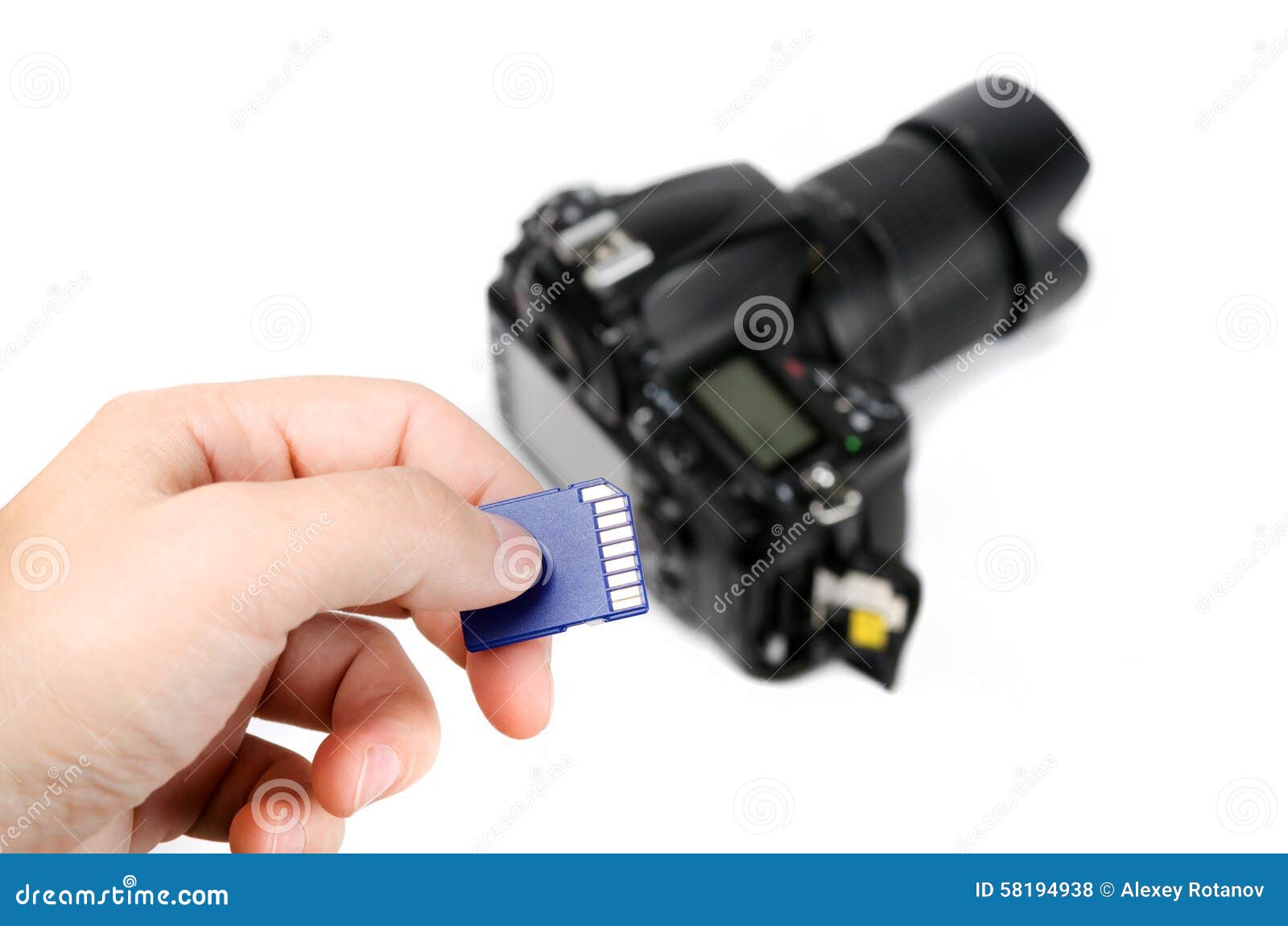 Hand Holds SD Memory Card with DSLR Camera on the Background Stock ...