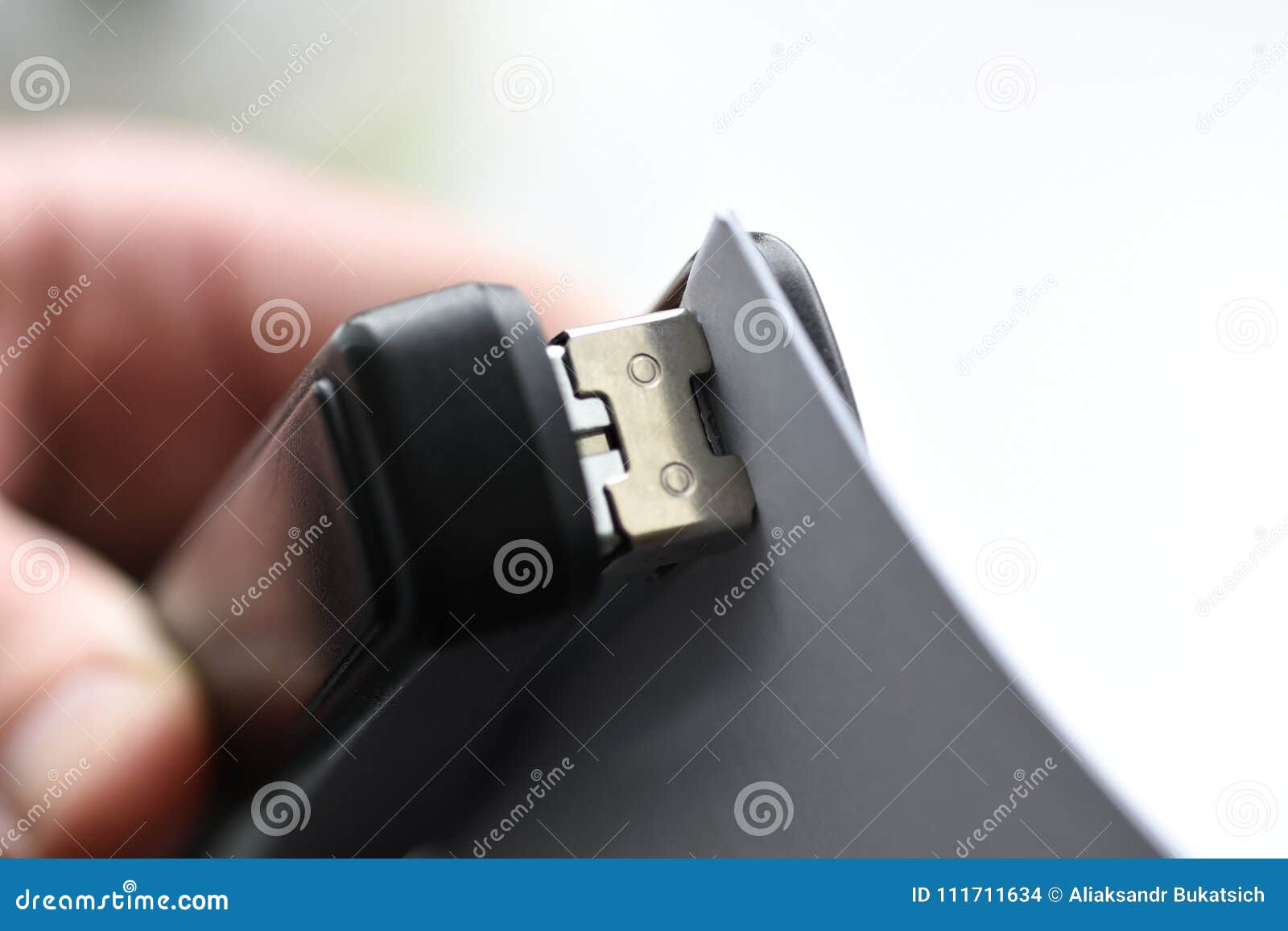The Hand Holds the Staples and Holds Together a Stack of Papers Stock ... The Hand Holds the Staples and Holds Together a Stack of Papers Stock ...