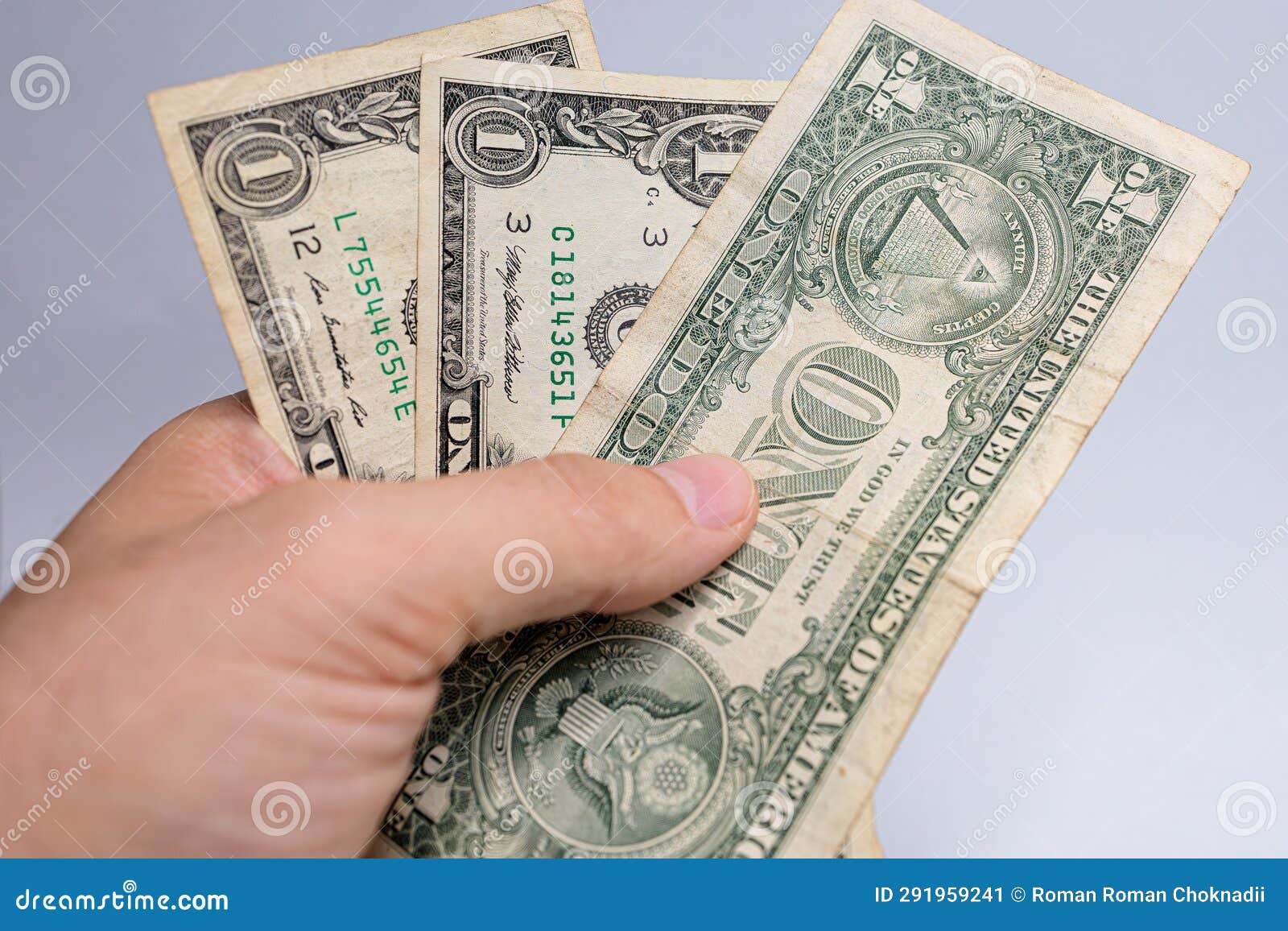 The Hand Holds Three One Dollar Bills. Hands Holding One Dollar Bills ...