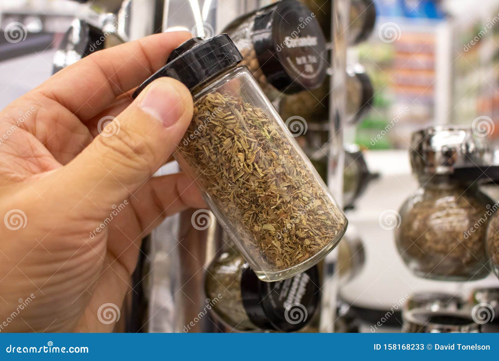 Spice rack and hand stock image. Image of kitchen, cuisine - 158168233