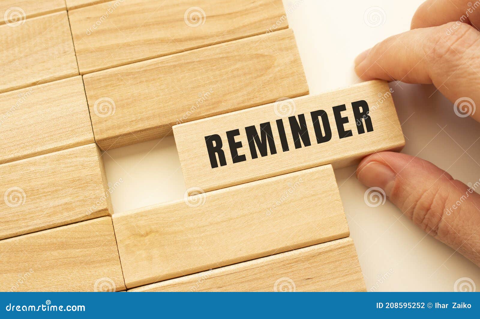 Hand Holds a Wooden Cube with the Text REMINDER Stock Photo - Image of ...