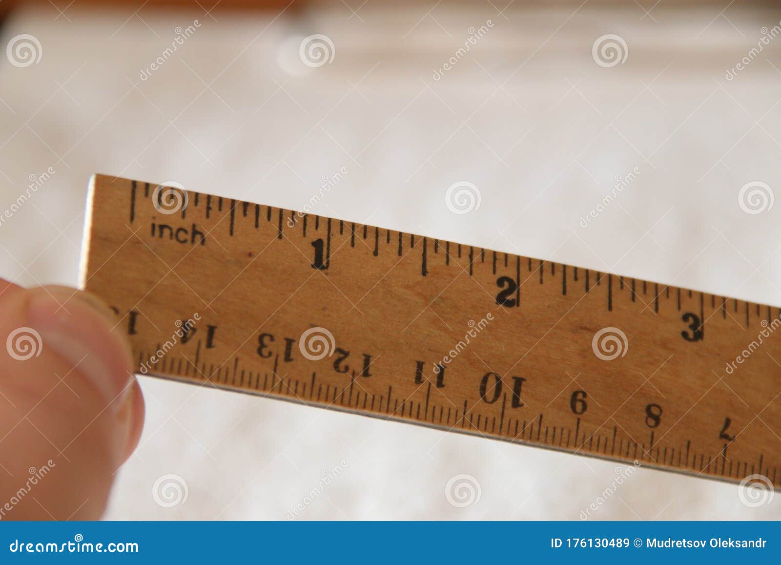 Hand holds a wooden ruler stock image. Image of college - 176130489