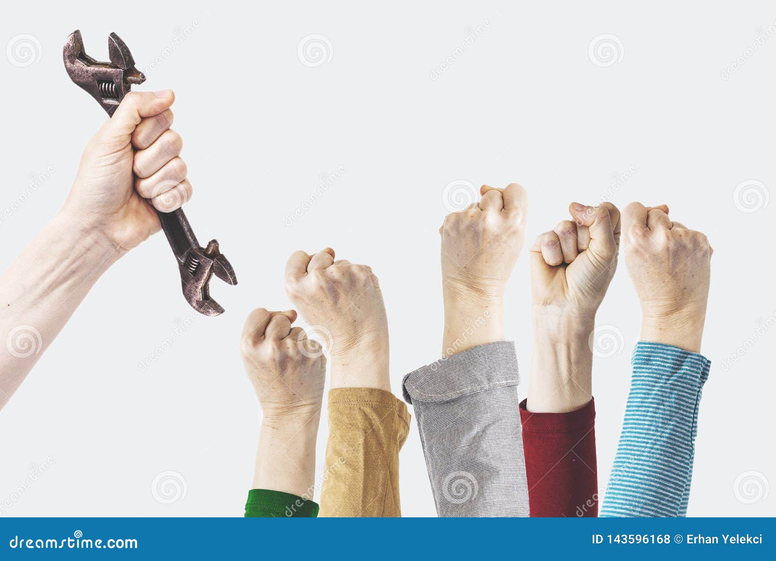 A Hand Holds a Wrench, Labor Day Photography Concept, Closeup of the ... A Hand Holds a Wrench, Labor Day Photography Concept, Closeup of the ...