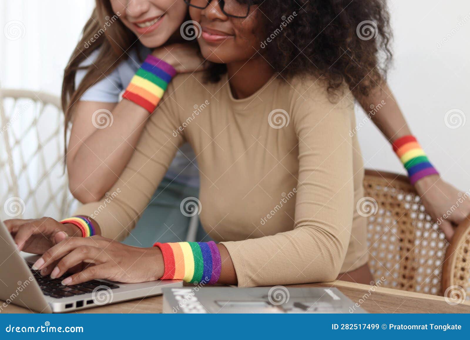 Hand Of Homosexual Lesbian Couple Wearing Lgbt Pride Rainbow Flag
