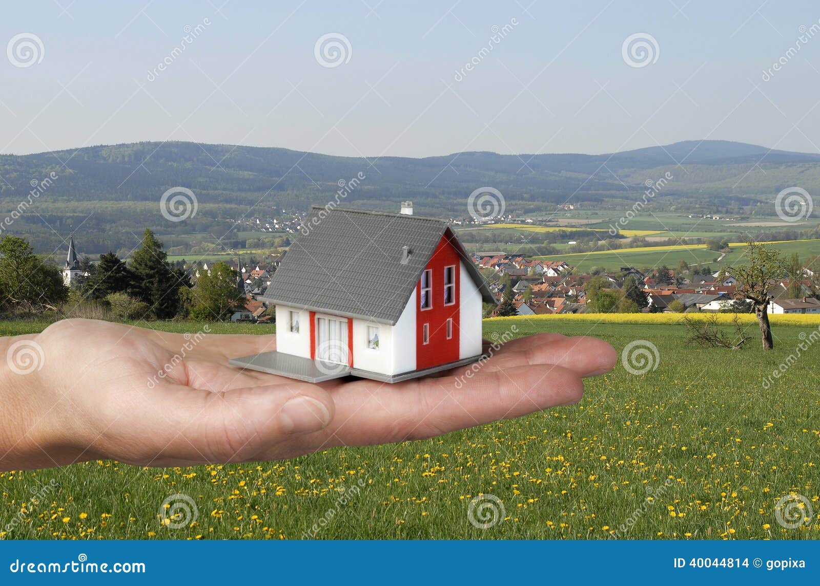 Hand with House in Front of Landscape Stock Photo - Image of ...