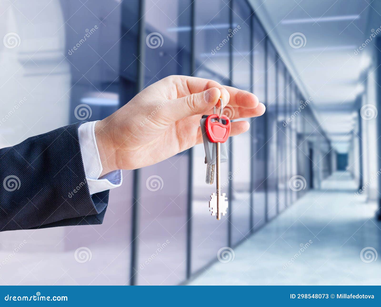 Hand with House Key Against Abstract Modern Office Building Background ...