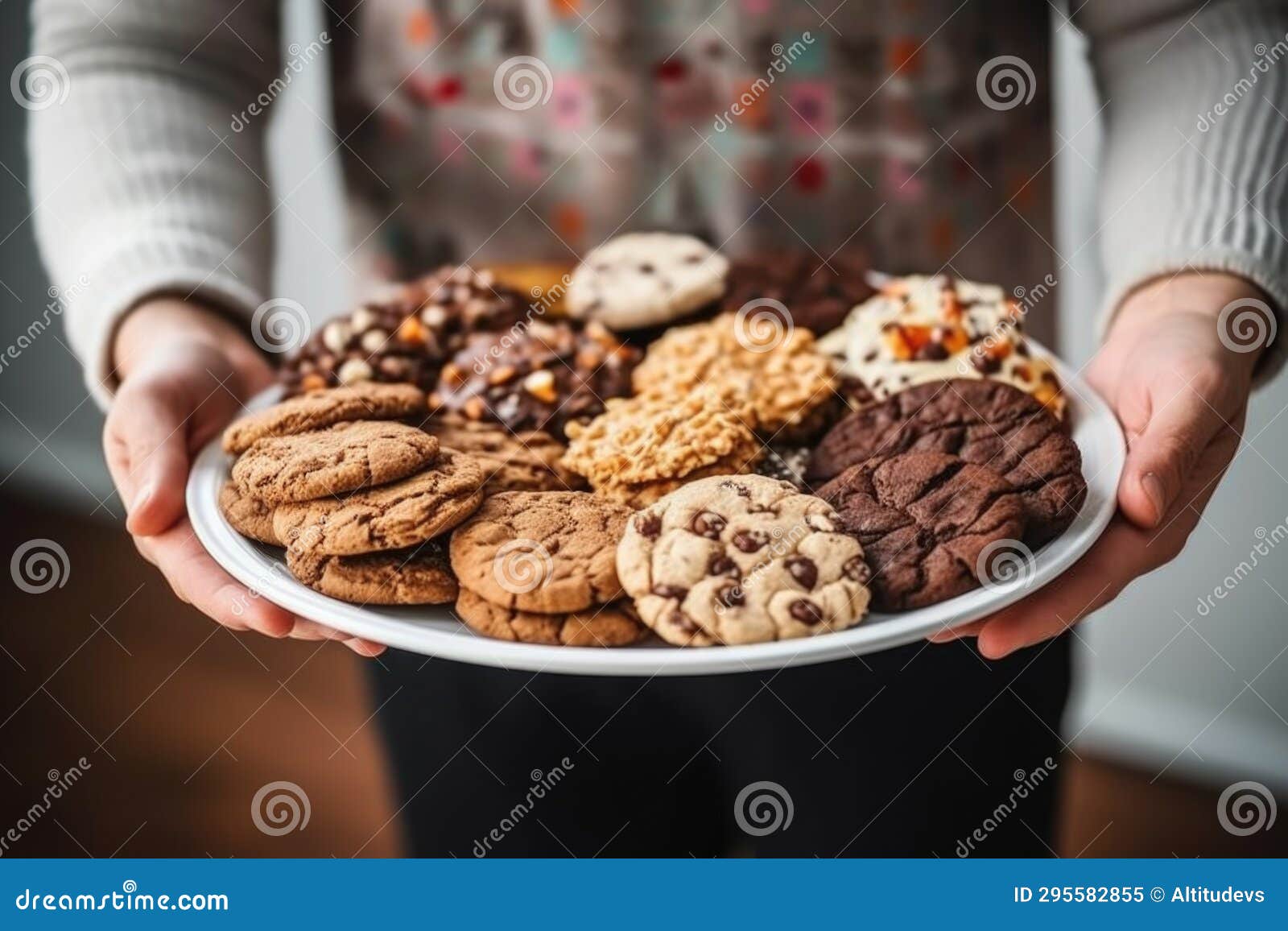 Hand Hovering Over a Platter of Cookies, Deciding Which One To Take ...
