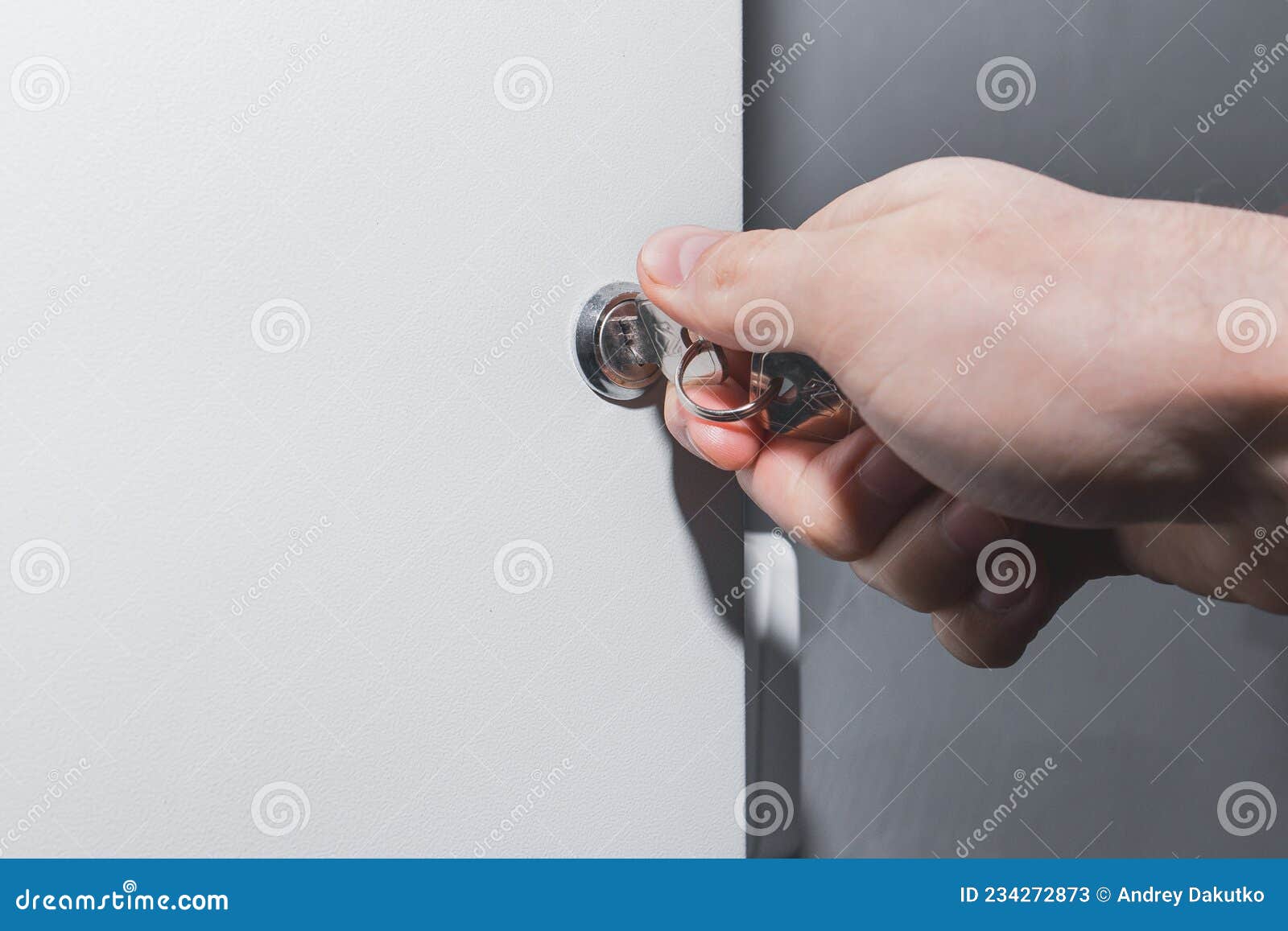 The Hand of a Human Electrician Opens or Closes the Electrical Box with ...