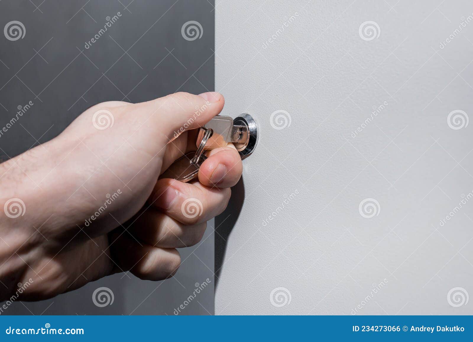 The Hand of a Human Electrician Opens or Closes the Electrical Box with ...