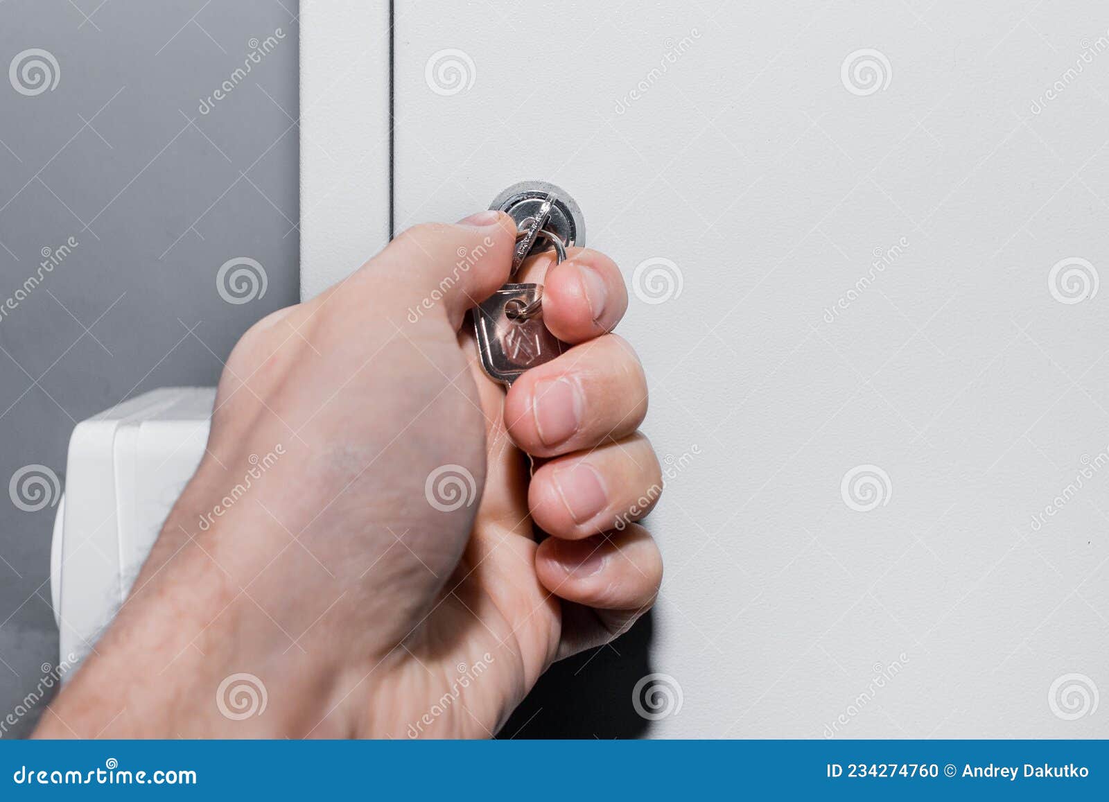The Hand of a Human Electrician Opens or Closes the Electrical Box with ...