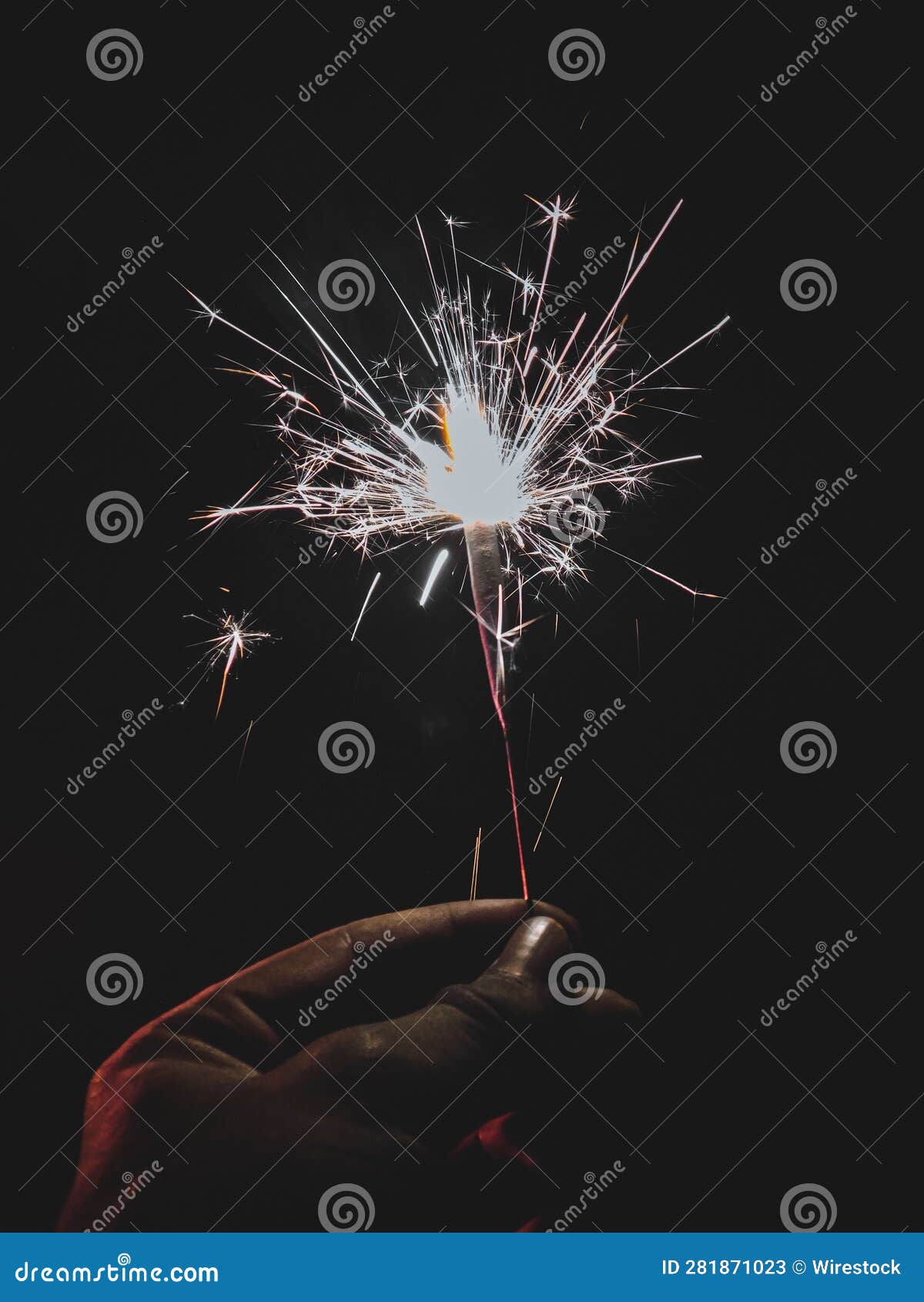 Hand Illuminated by the Light of a Sparkler at Night, Creating a ...
