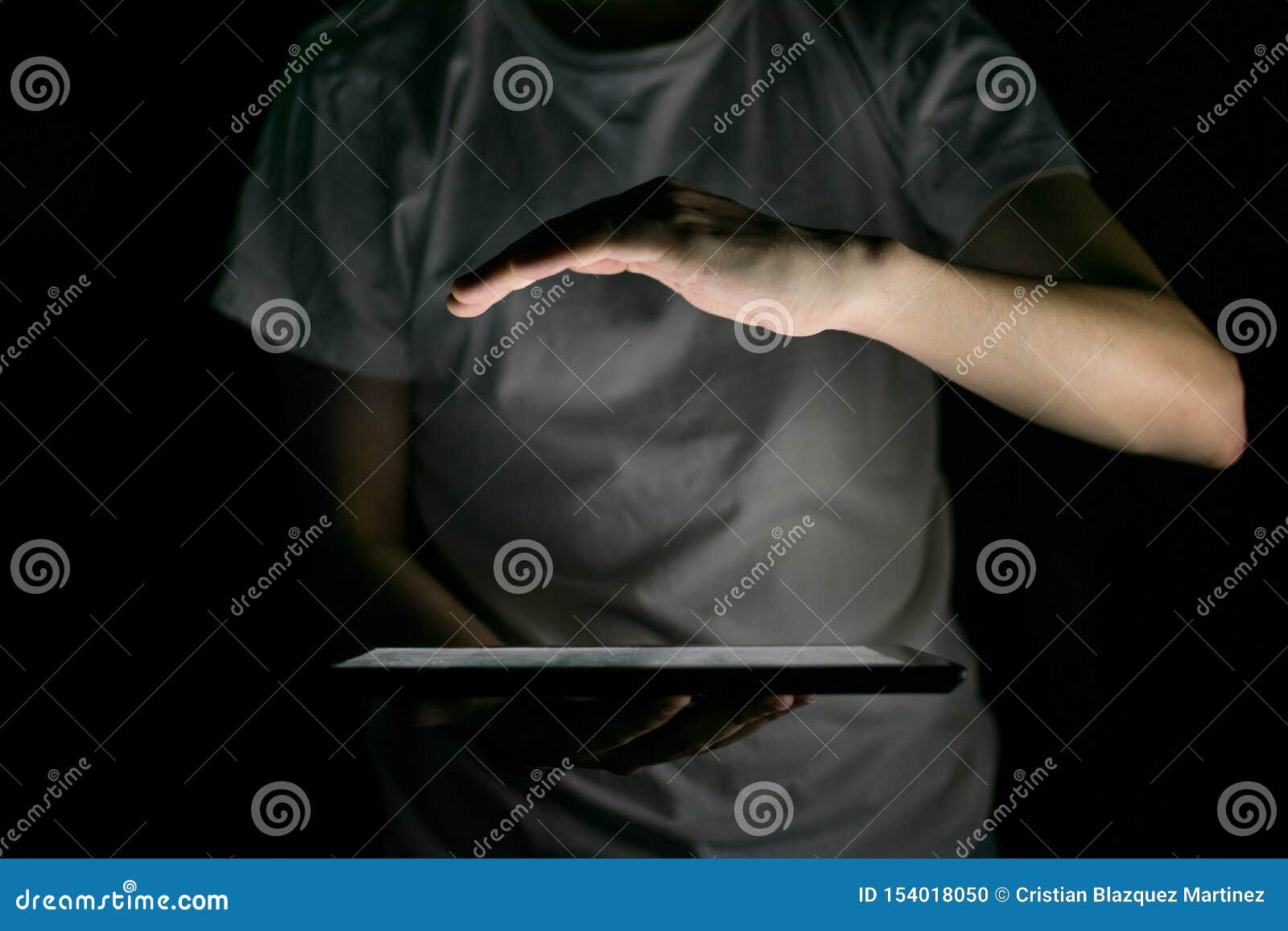 Hand Illuminated by the Light of a Tablet Stock Photo - Image of ...